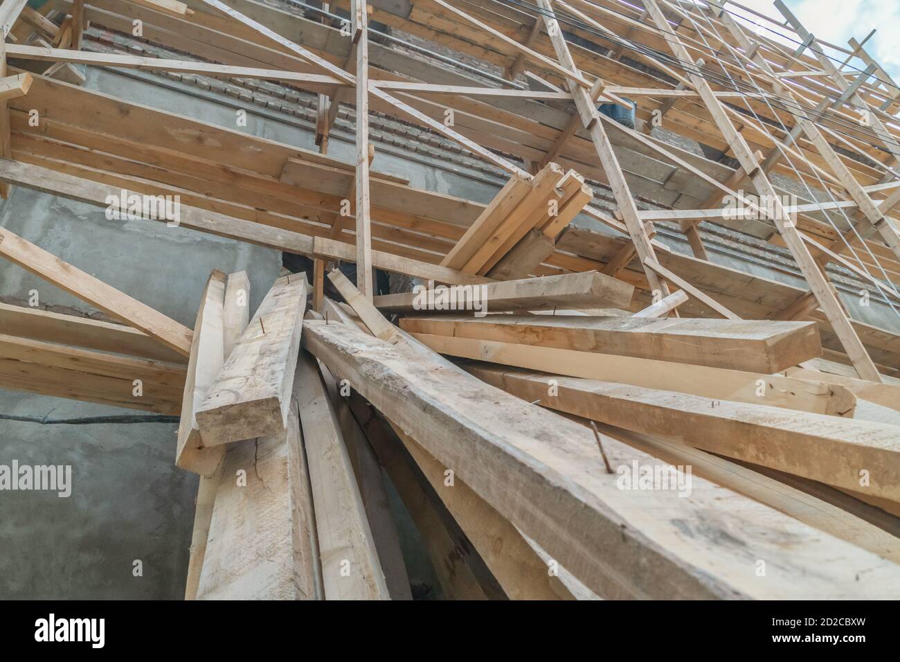 Home construction. Wooden scaffolding on a building close up Stock ...