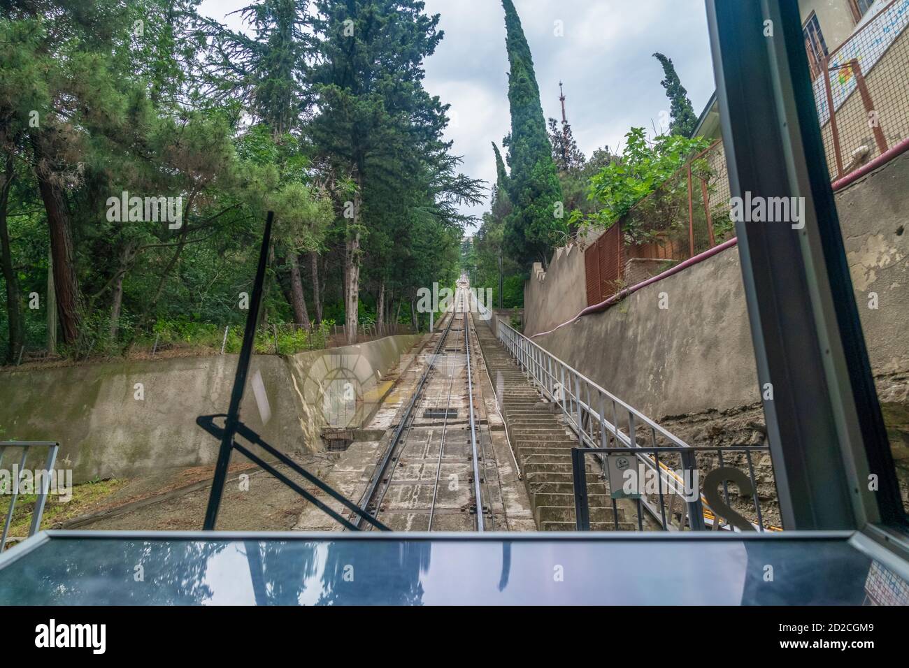 The Mtatsminda funicular in Tbilisi is a view from the inside. The road ...