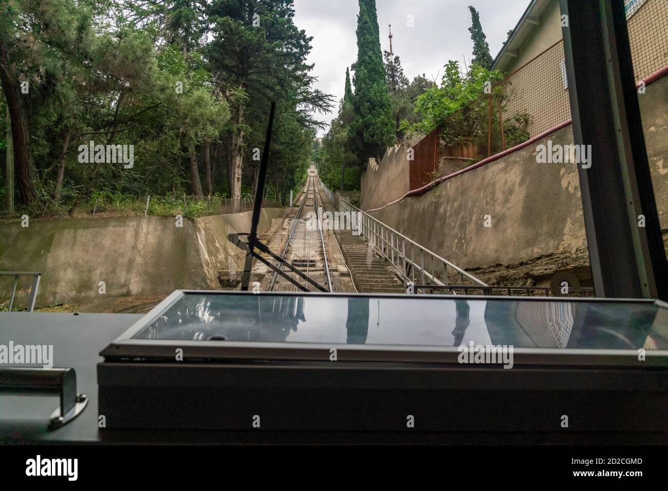 The Mtatsminda funicular in Tbilisi is a view from the inside. The road ...