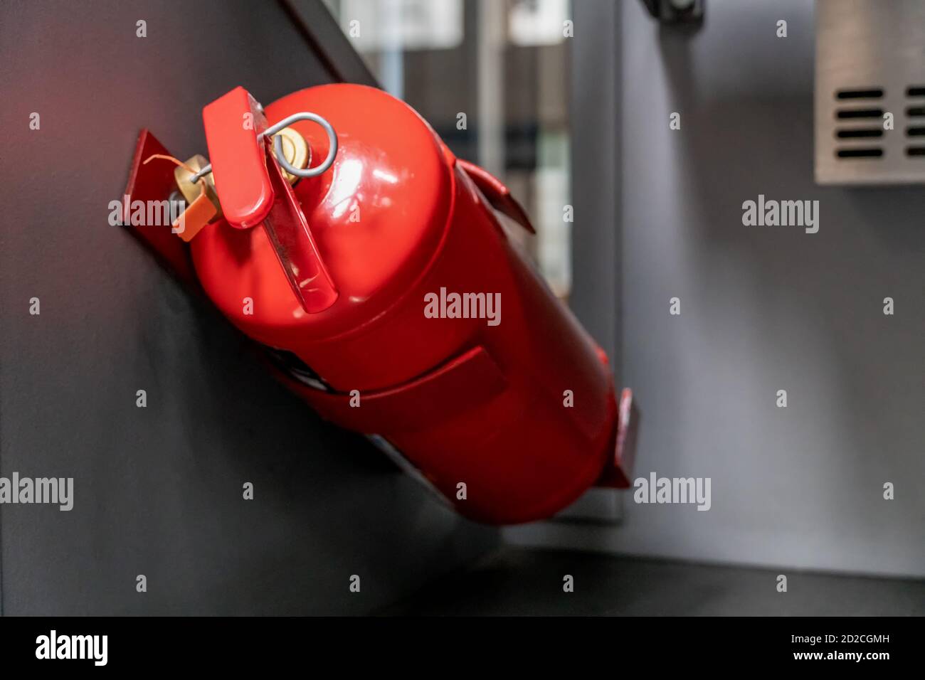 Red fire extinguisher closeup in the funicular cabin. The concept of ...