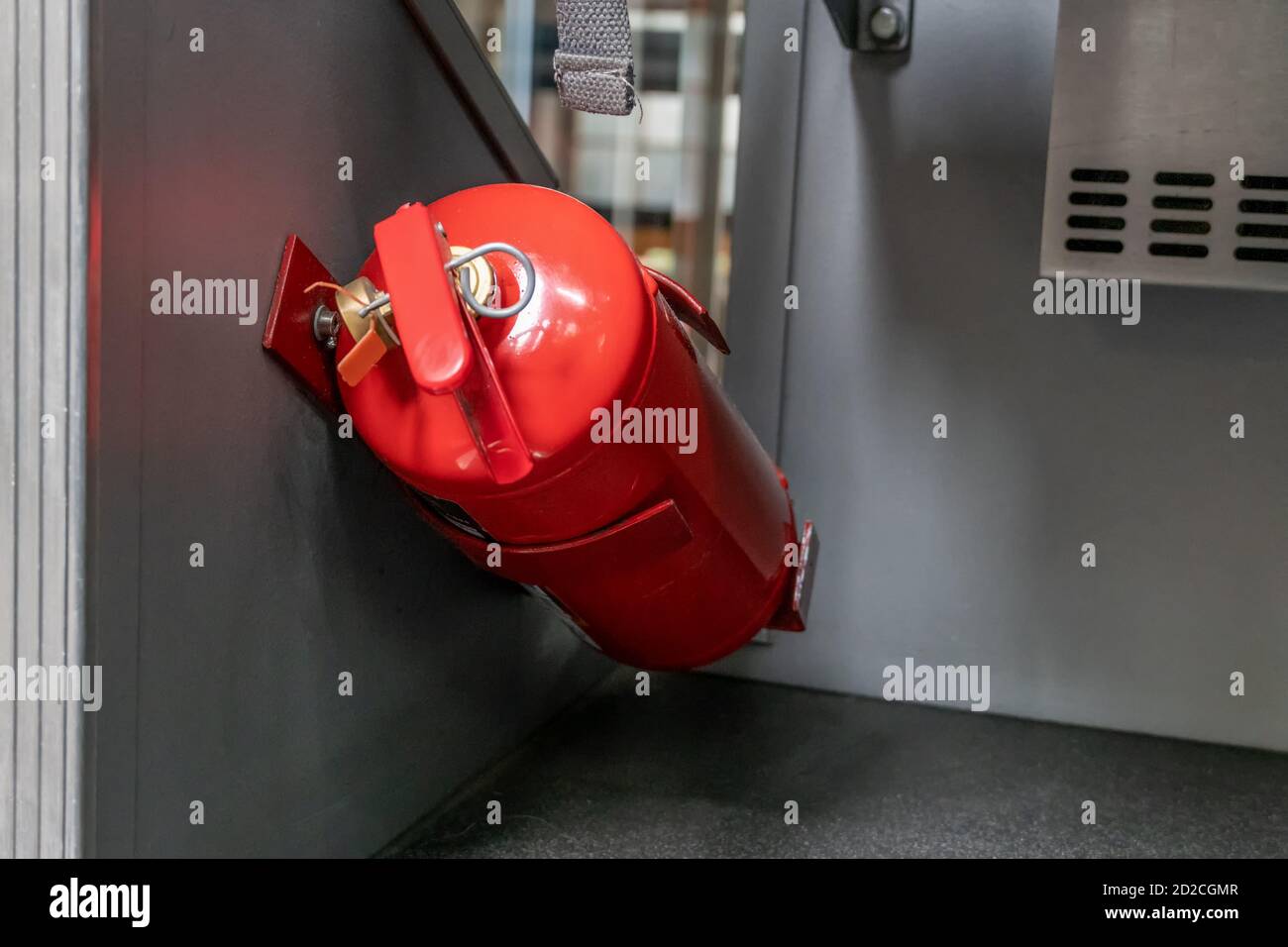 Red fire extinguisher closeup in the funicular cabin. The concept of ...