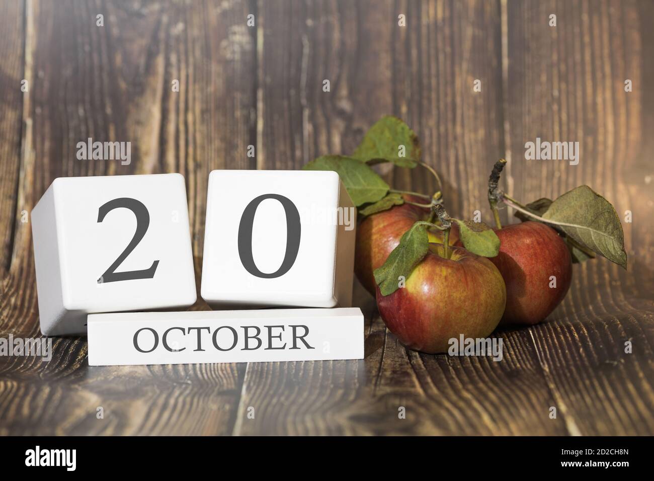 October 20. Day 20 of month. Calendar cube on wooden background with ...