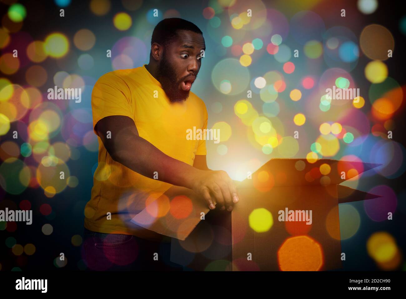 Surprised man receives Christmas gift. happy and surprised expression ...