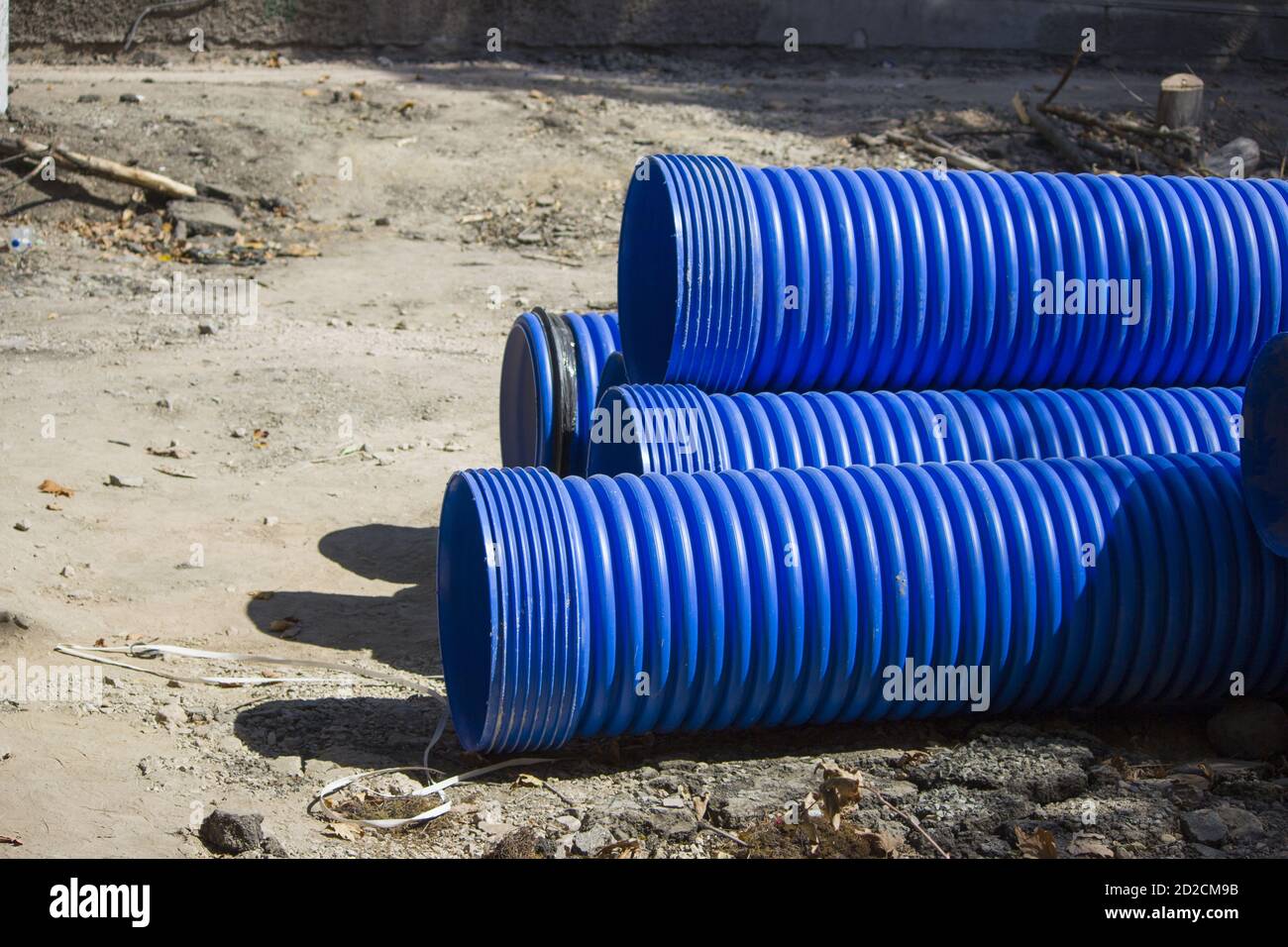 Several of blue plastic corrugated plumbing pipe Stock Photo - Alamy