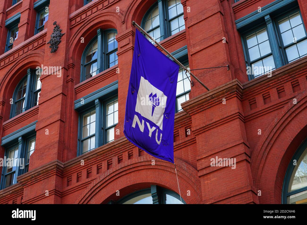 NEW YORK CITY, NY -27 SEP 2020- View of a purple school flag on the ...