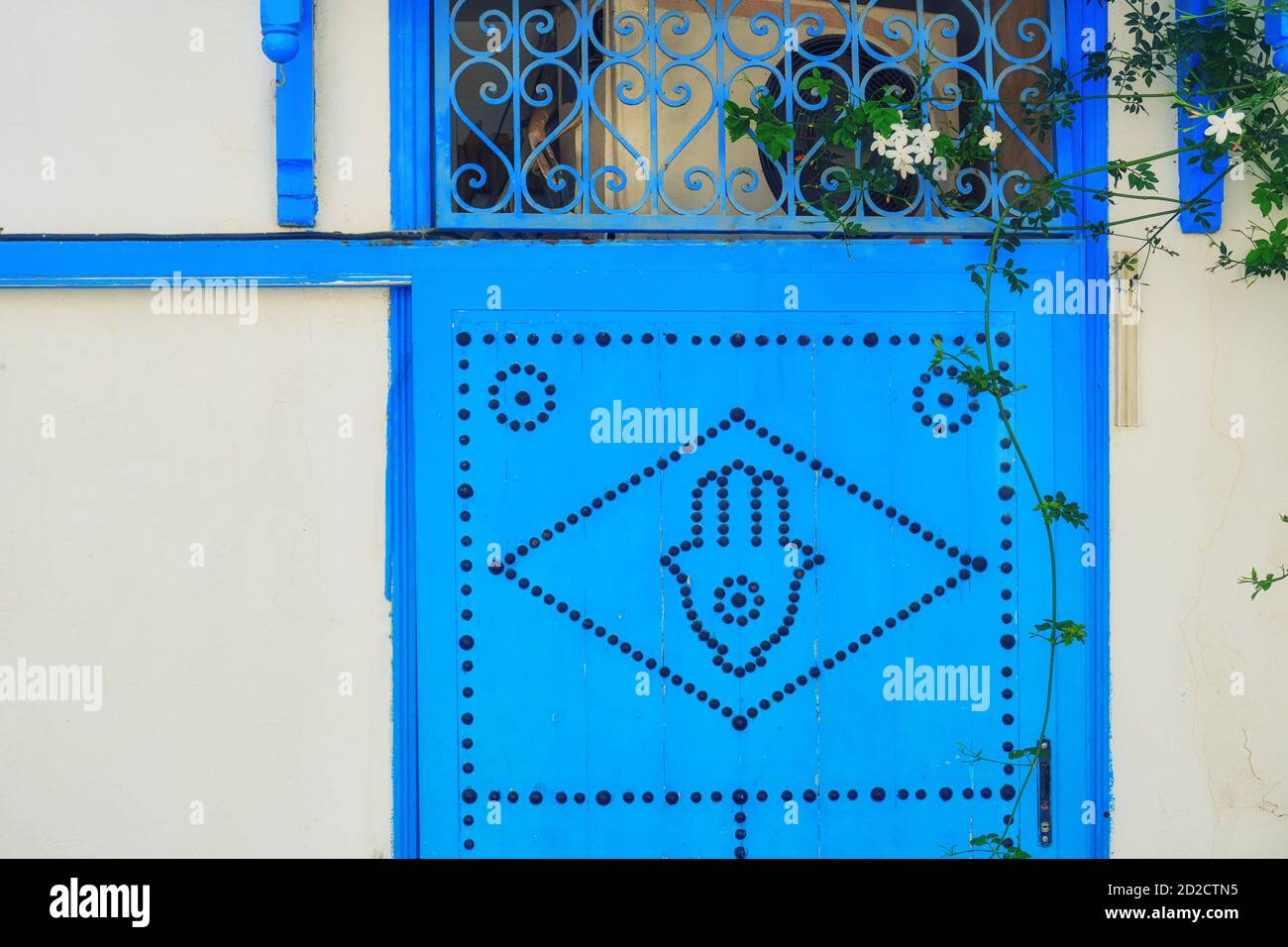 Door with muslim symbols the hand of Fatima and arabic ornament, Sidi ...