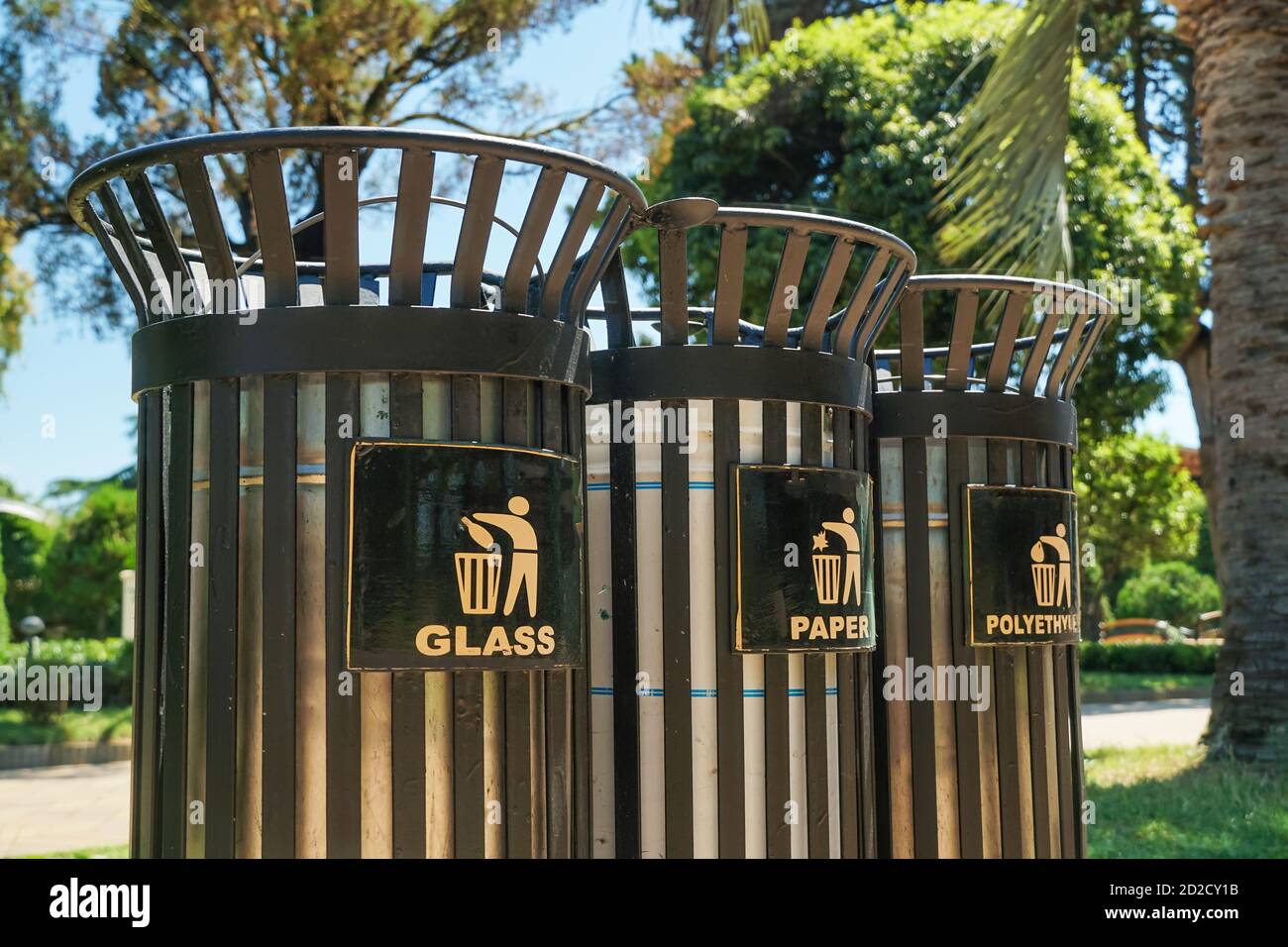 Modern, metal containers for separate waste collection in the park on a ...