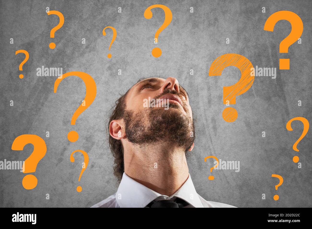 Confused and pensive expression of a businessman with a lot of question ...