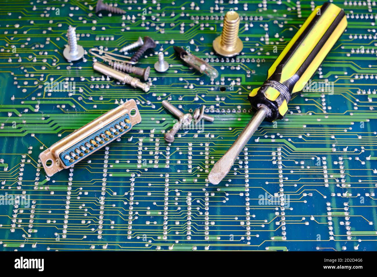 Screwdriver for electronics repair against circuit board Stock Photo ...