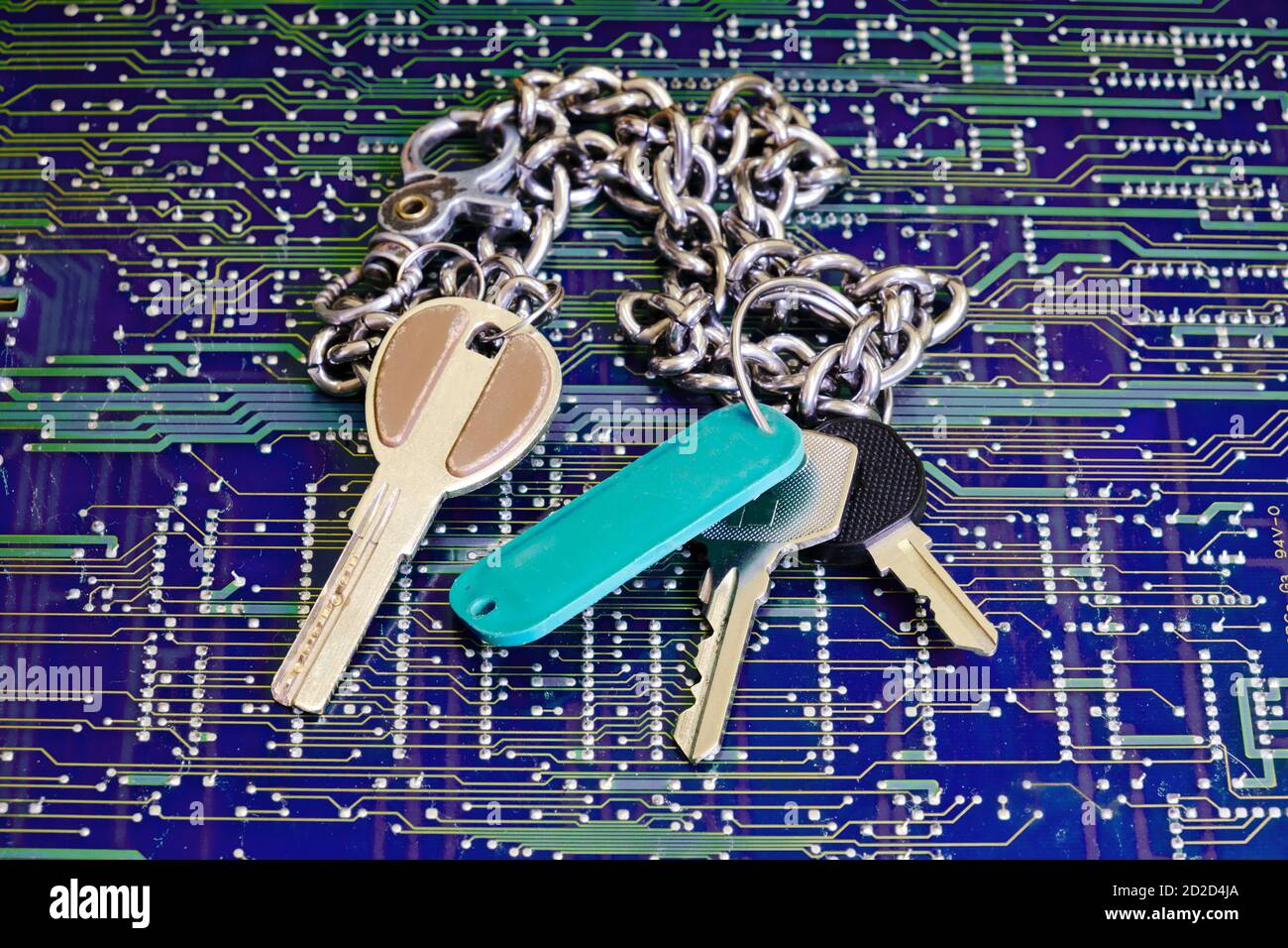 A bunch of keys on a chain against electronic circuit board Stock Photo ...