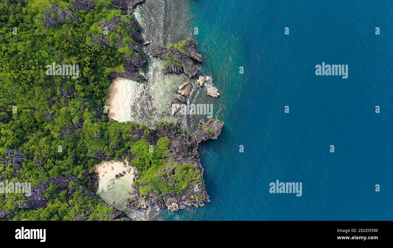 Tropical island with sandy with tourists and blue sea, aerial view ...