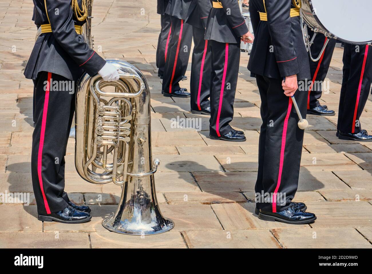 Military musicians at a performance with a tuba and a drum in their ...
