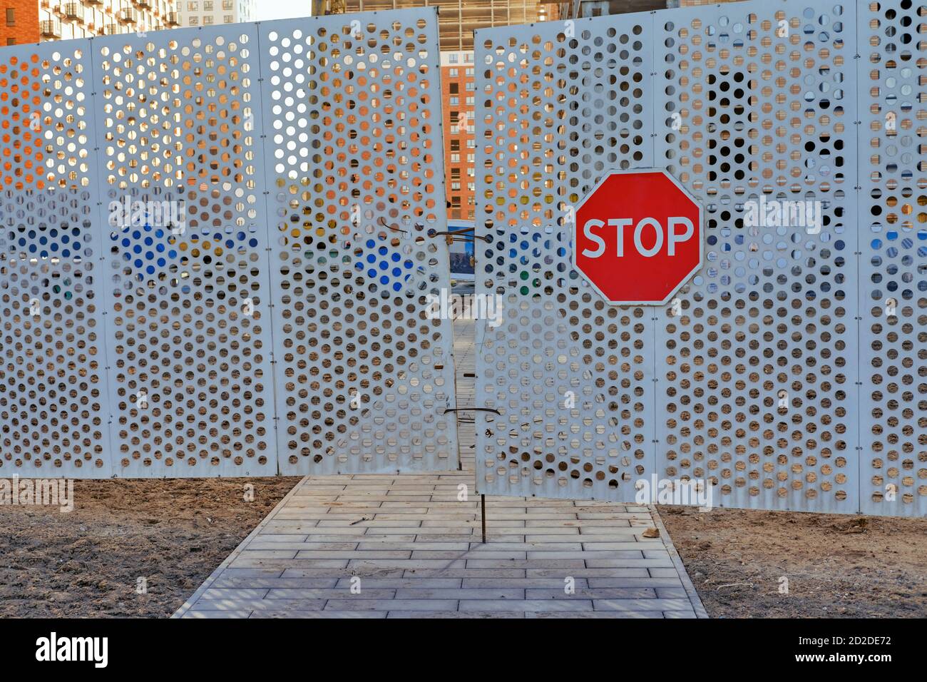 A stop sign on a locked gate because of the quarantine diseases of ...