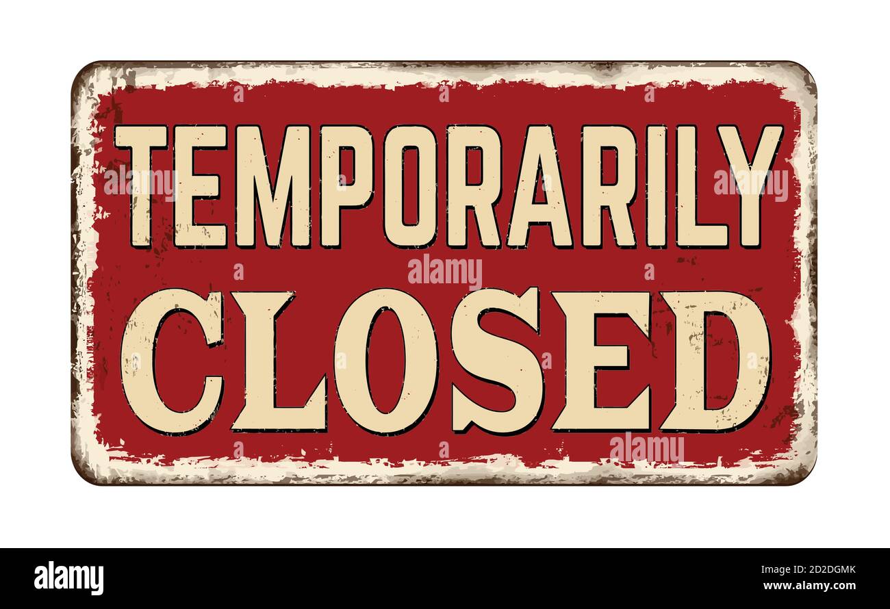 Temporarily closed vintage rusty metal sign on a white background ...