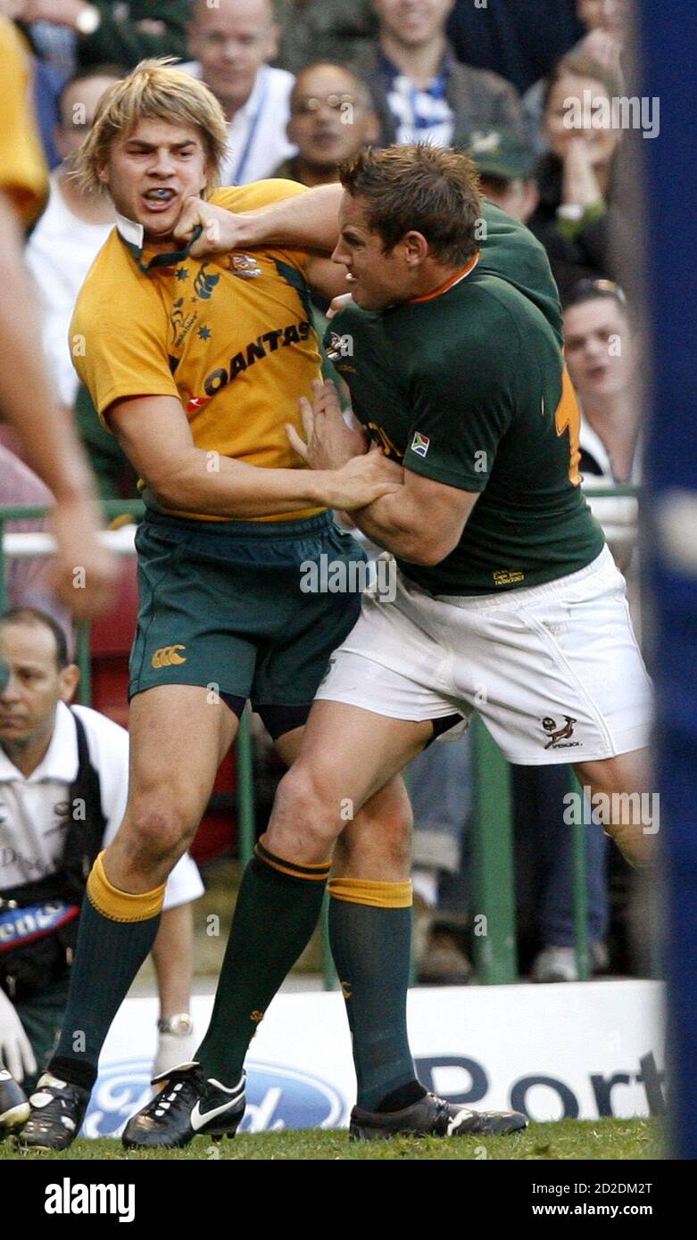 Australia's Drew Mitchell (L) and South Africa's Butch James clash ...