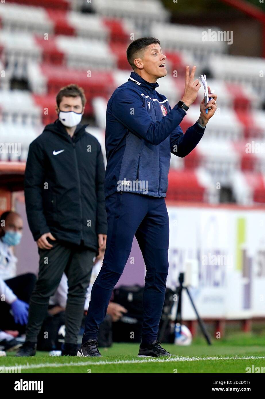 Stevenage's manager Alex Revell gestures on the touchline during the ...