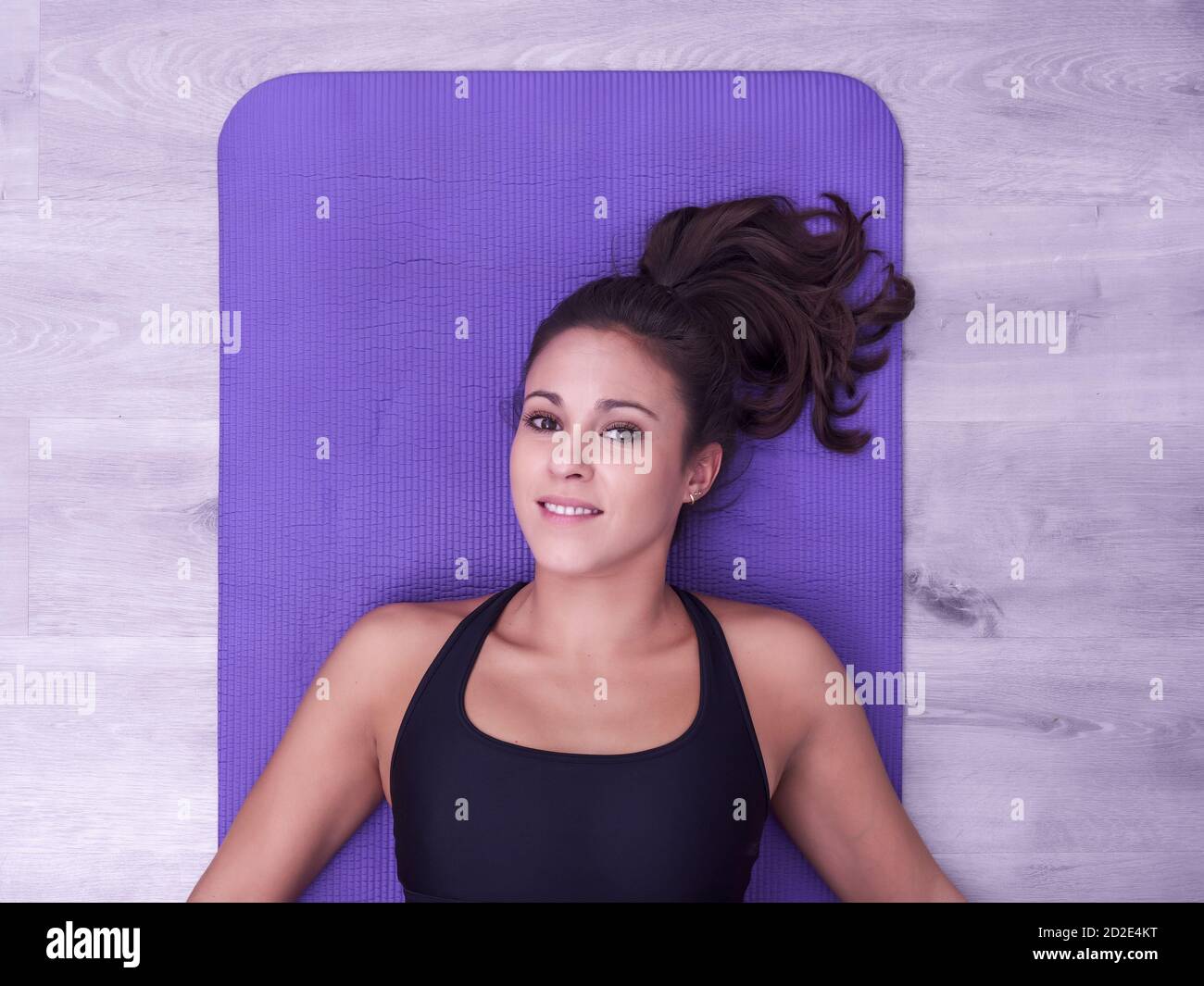 Caucasian woman laying and resting after the workout Stock Photo - Alamy