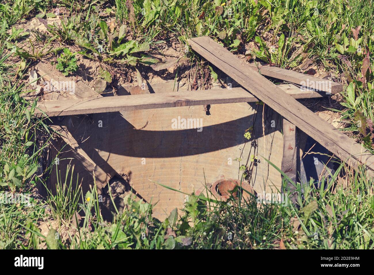 Violation of safety regulations with an open hatch. Dangerous well ...