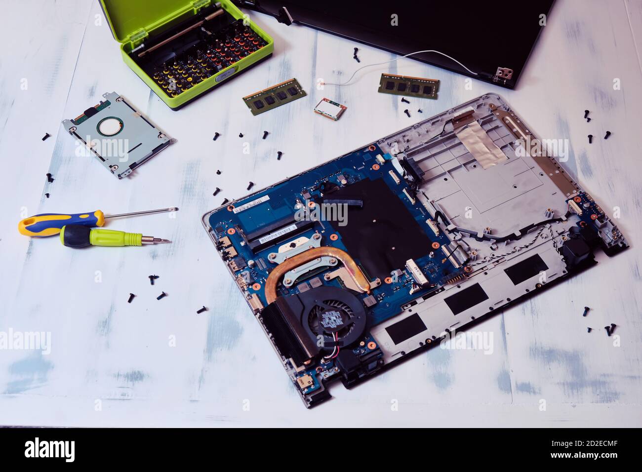 Disassembled notebook on white background. Checking the processor and ...