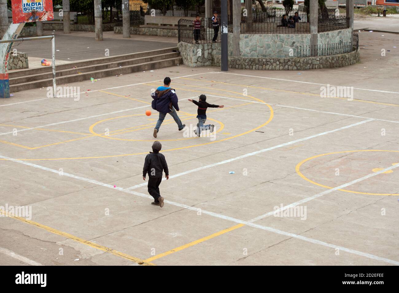 Indigenous Kiche (Quiché) Maya playing football (soccer). San Pedro ...