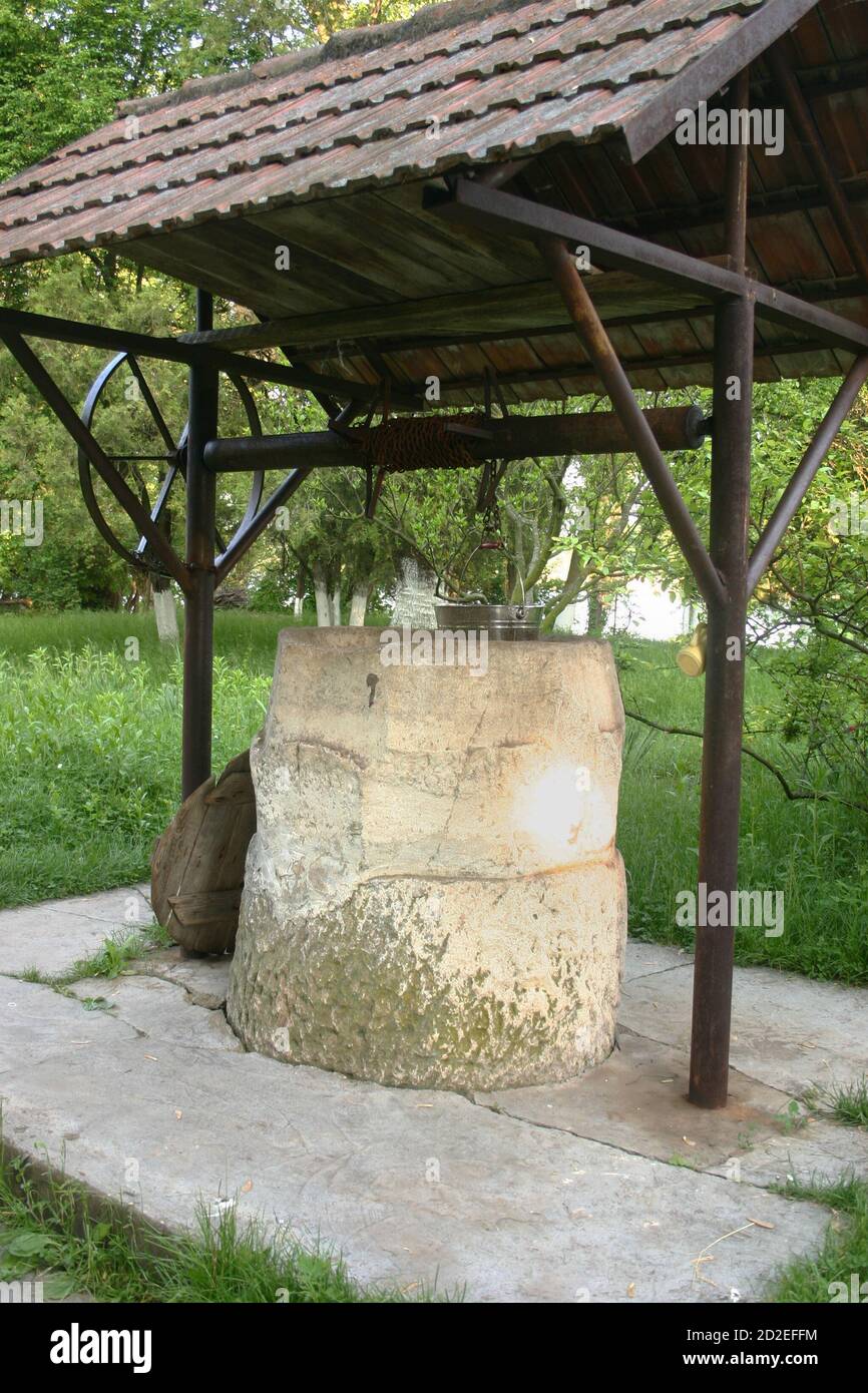 Simple traditional water well on the grounds of Snagov Monastery ...