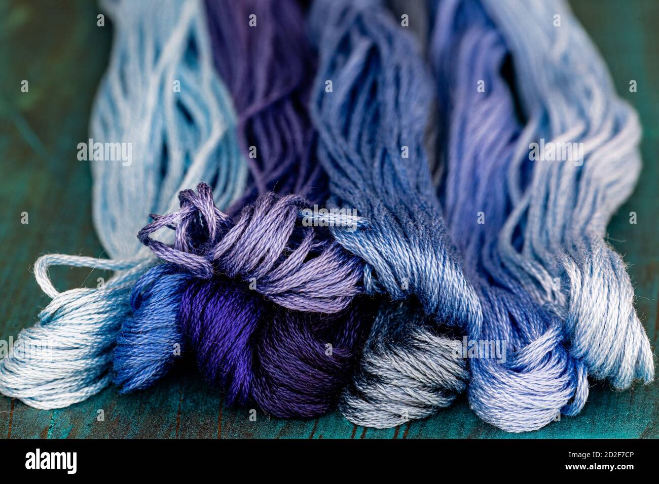 close-up shades of blue embrodery thread, still-life Stock Photo - Alamy