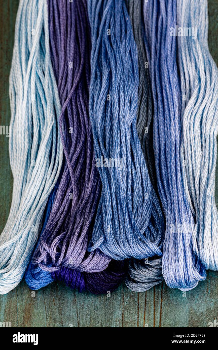 close-up shades of blue embrodery thread, still-life Stock Photo - Alamy