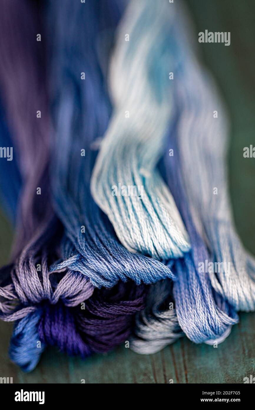 close-up shades of blue embrodery thread, still-life Stock Photo - Alamy
