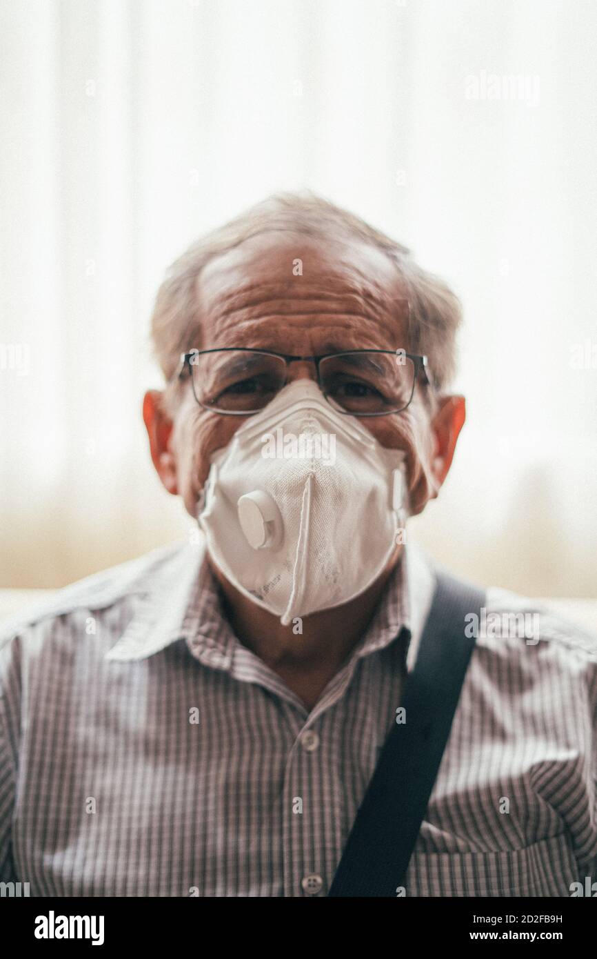 Old man working in pandemic quarantine Stock Photo - Alamy