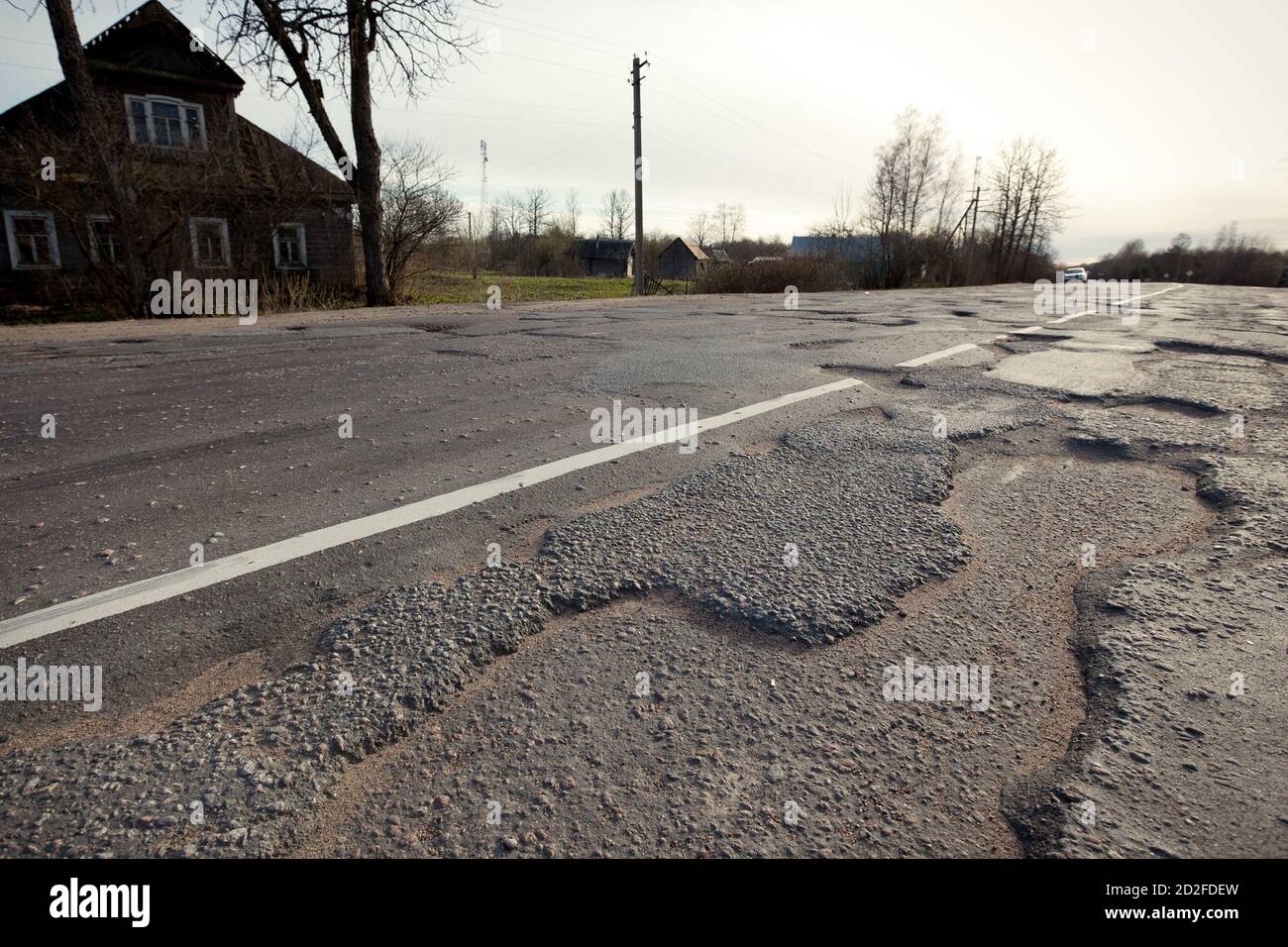 Bad quality road with potholes, hole in asphalt. Transportation, risk ...