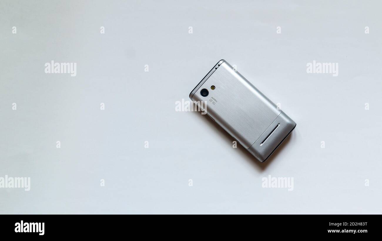 Back side of a small sliding mobile phone on white background Stock ...