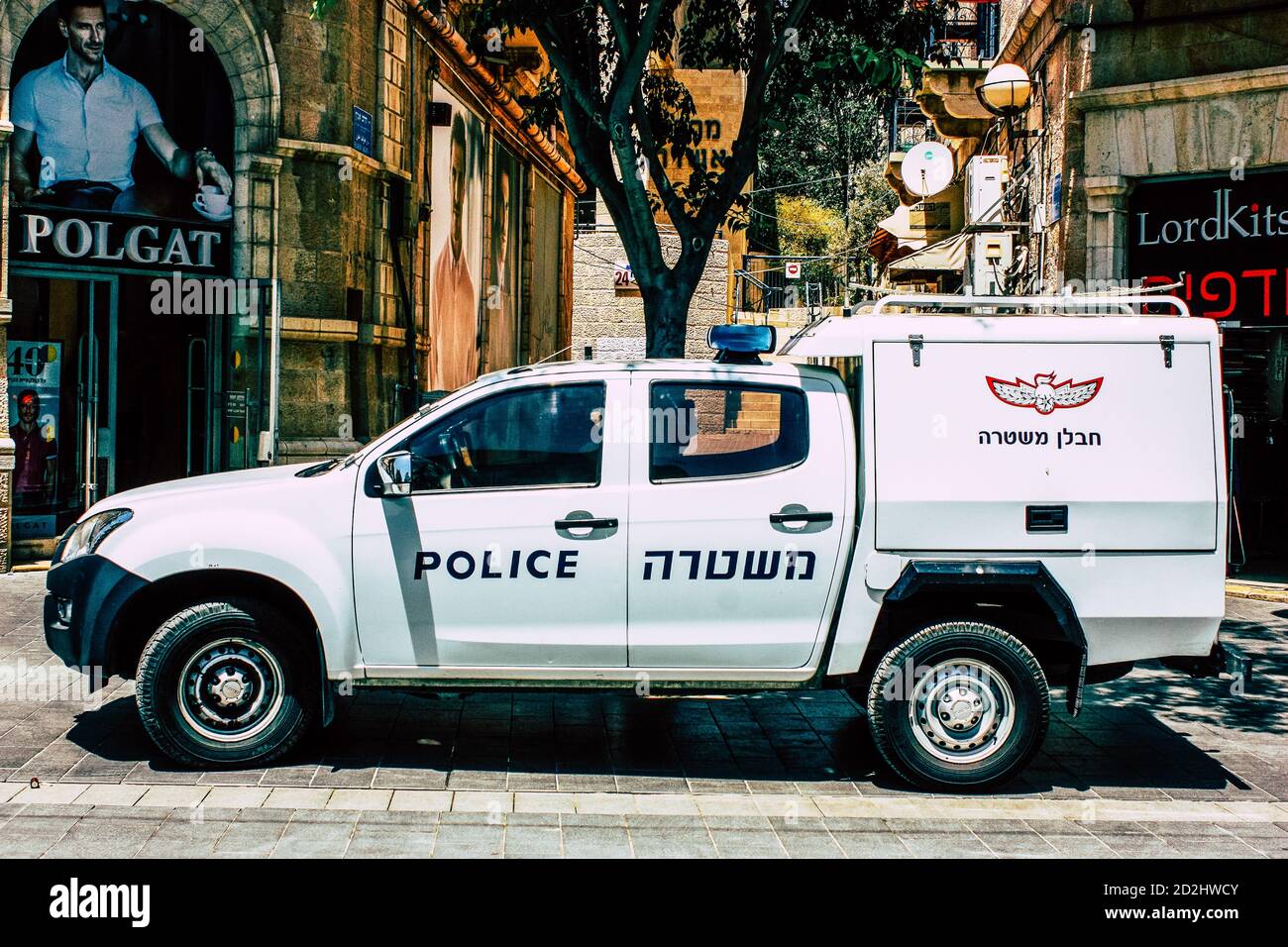 Closeup of an official police car patrolling the streets of the city ...