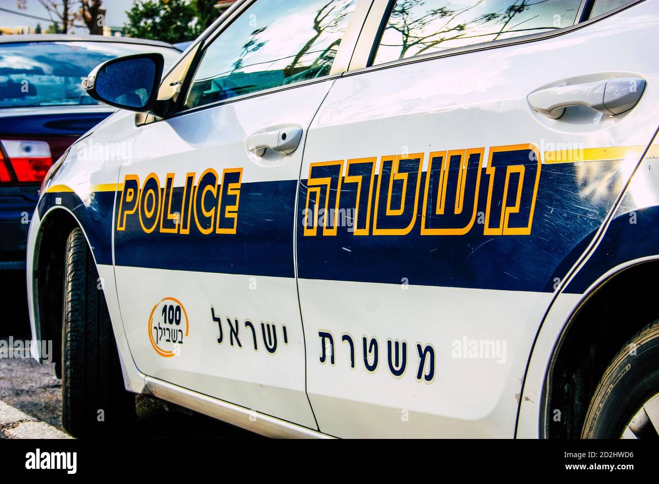 Closeup of an official police car patrolling the streets of the city ...