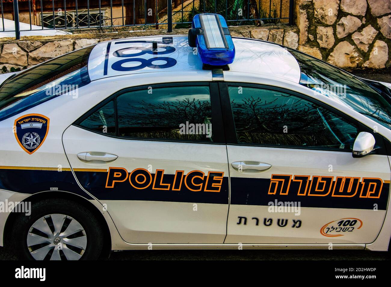 Closeup of an official police car patrolling the streets of the city ...