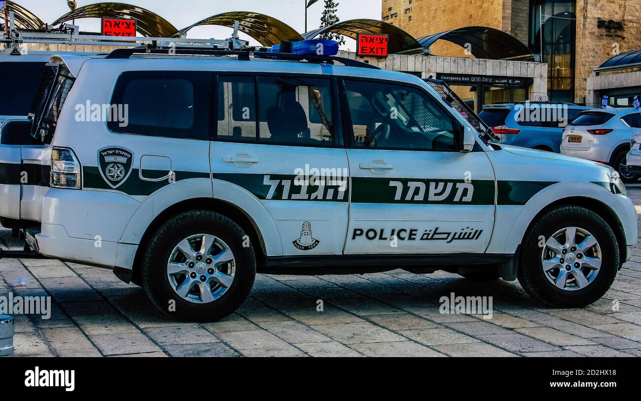 Closeup of an official police car patrolling the streets of the city ...