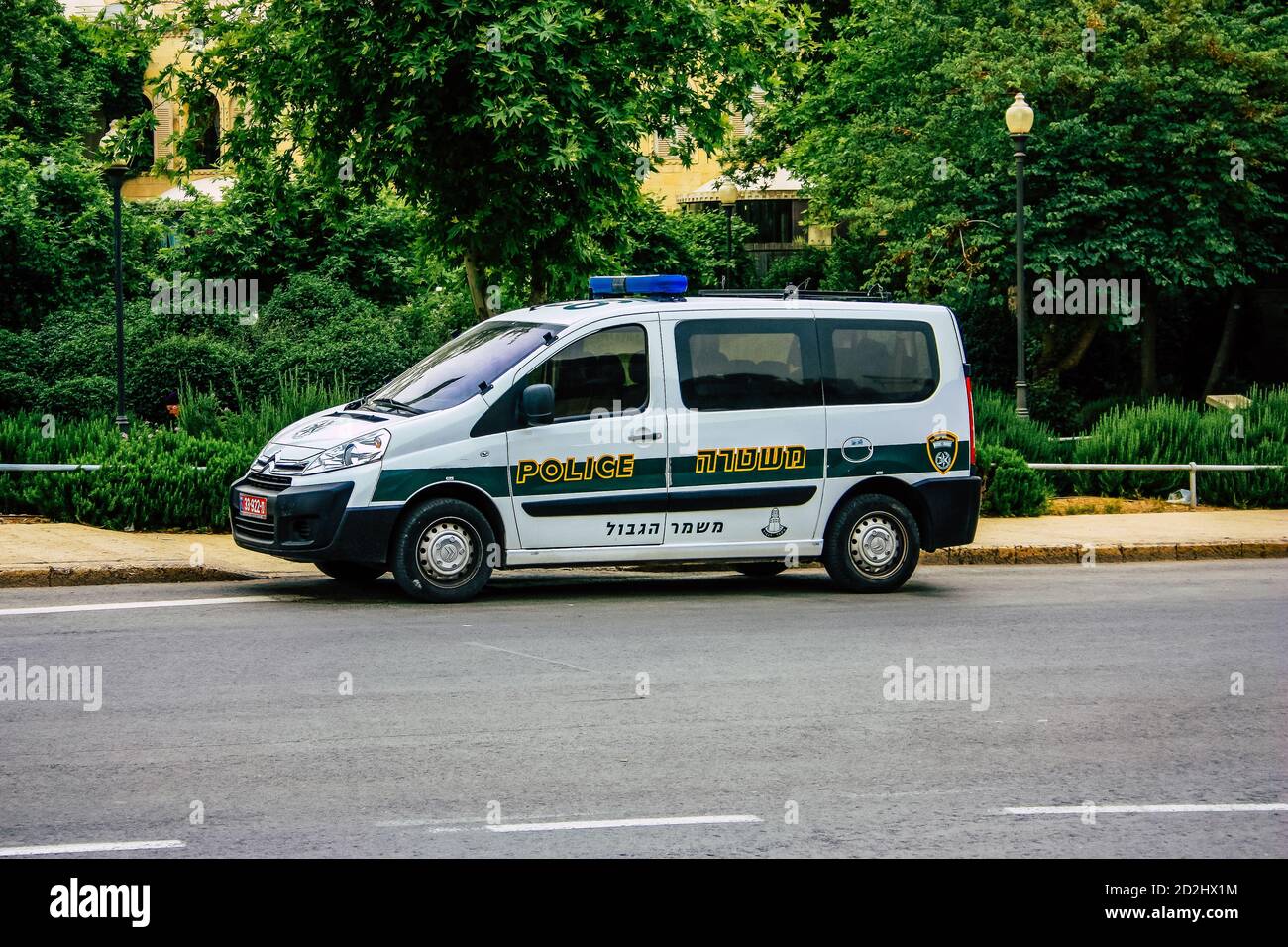 Closeup of an official police car patrolling the streets of the city ...