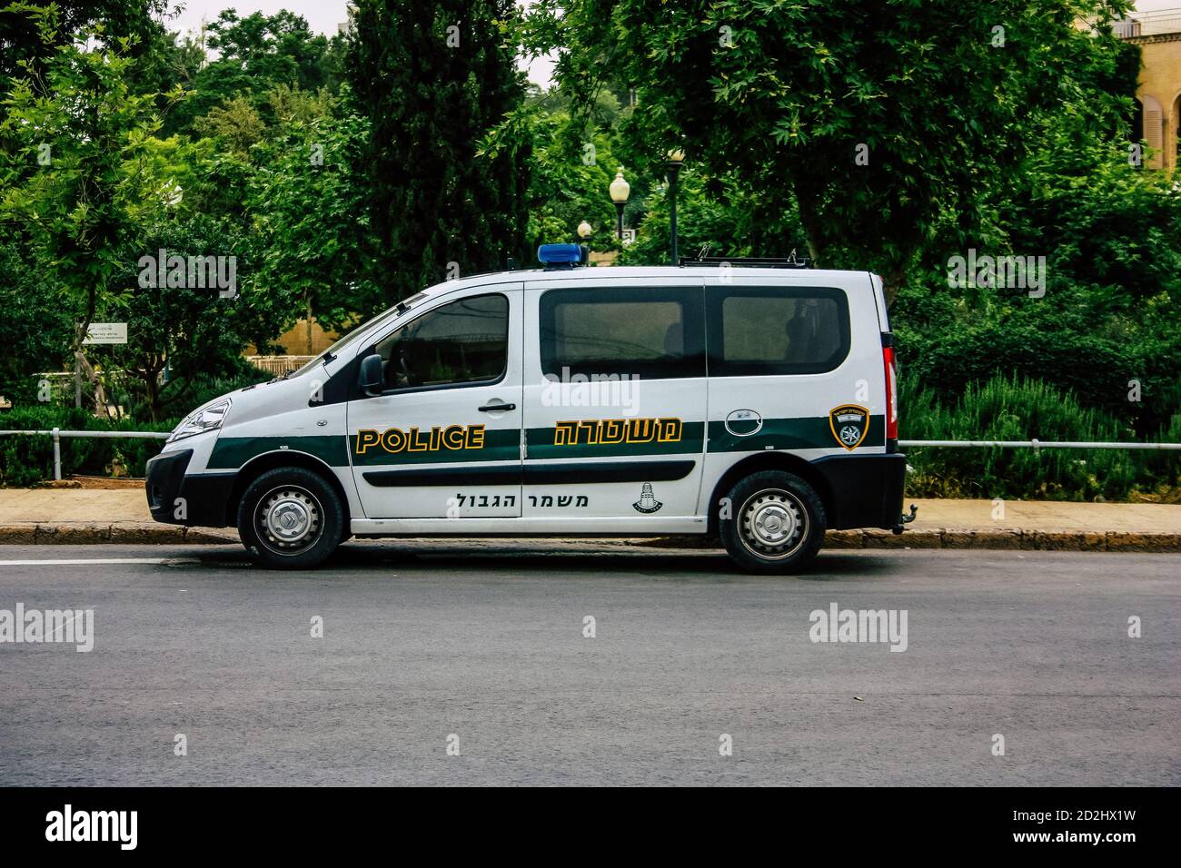 Closeup of an official police car patrolling the streets of the city ...