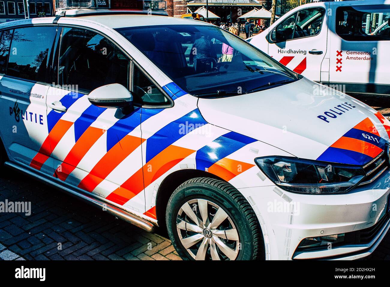 Closeup of an official police car patrolling the streets of the city ...