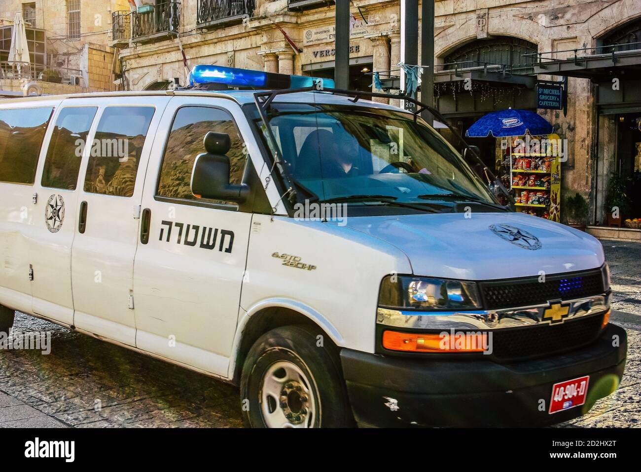 Closeup of an official police car patrolling the streets of the city ...