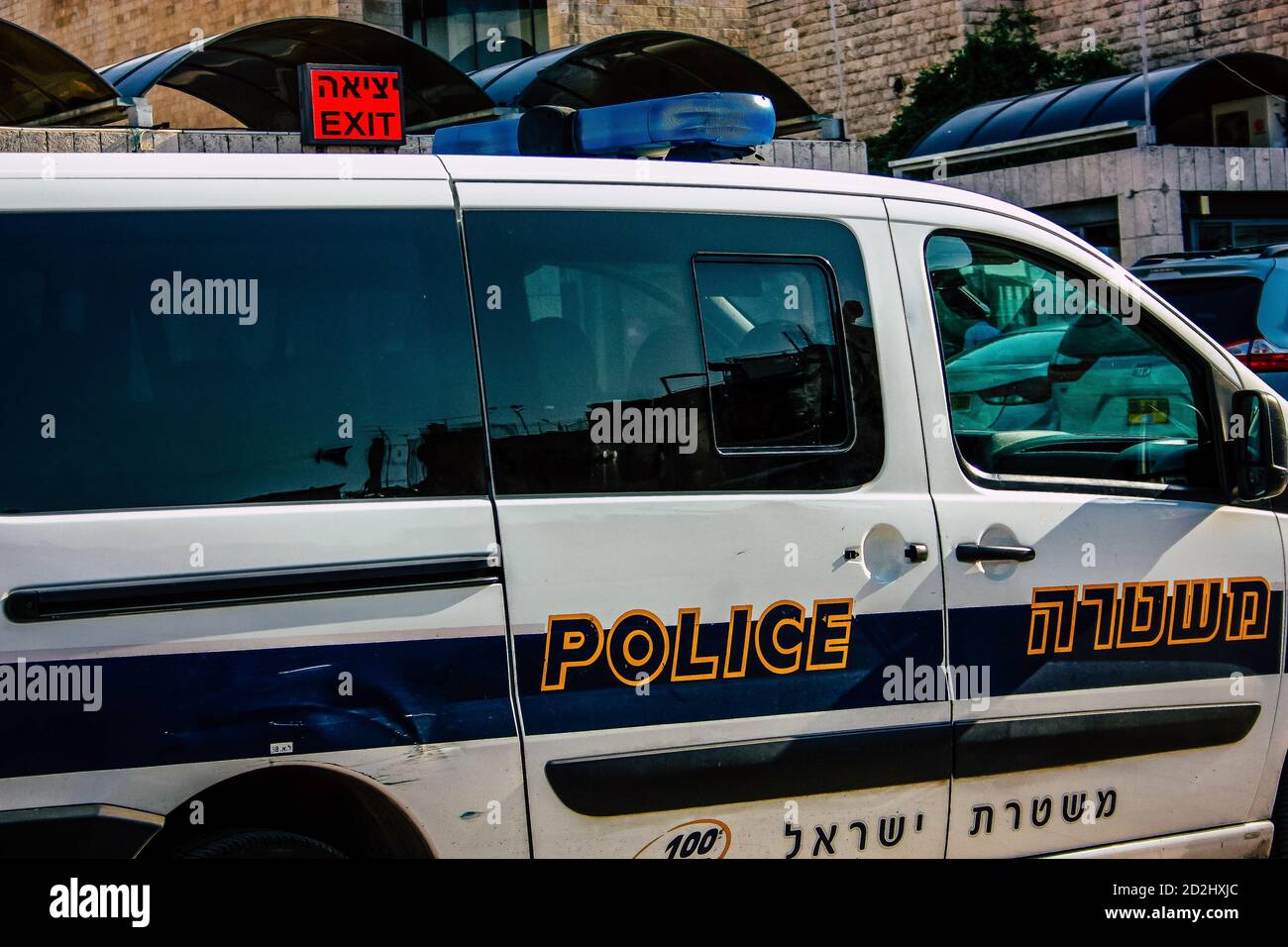 Closeup of an official police car patrolling the streets of the city ...