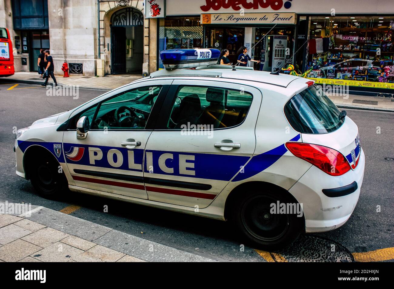 Closeup of an official police car patrolling the streets of the city ...