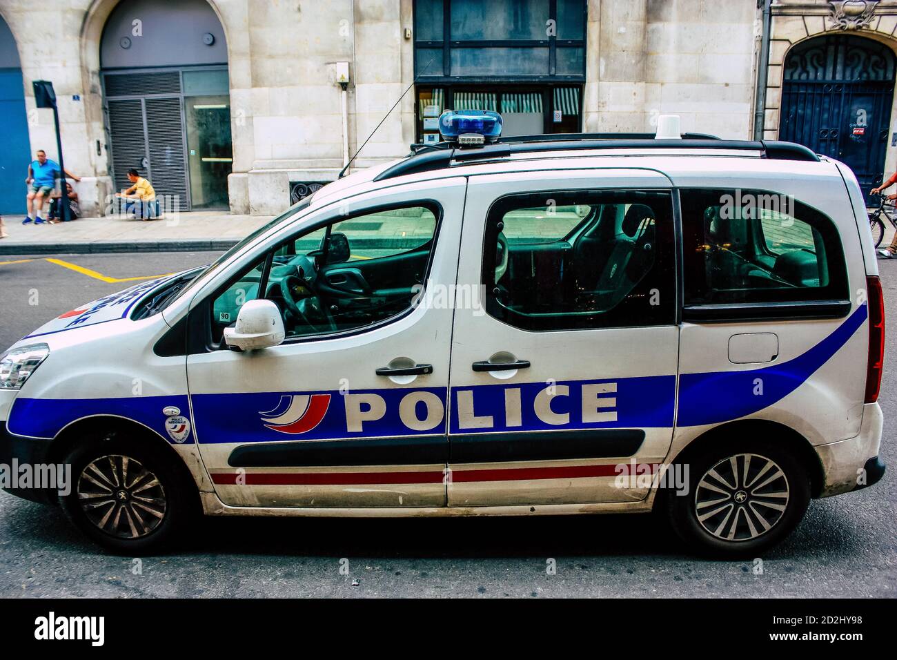 Closeup of an official police car patrolling the streets of the city ...