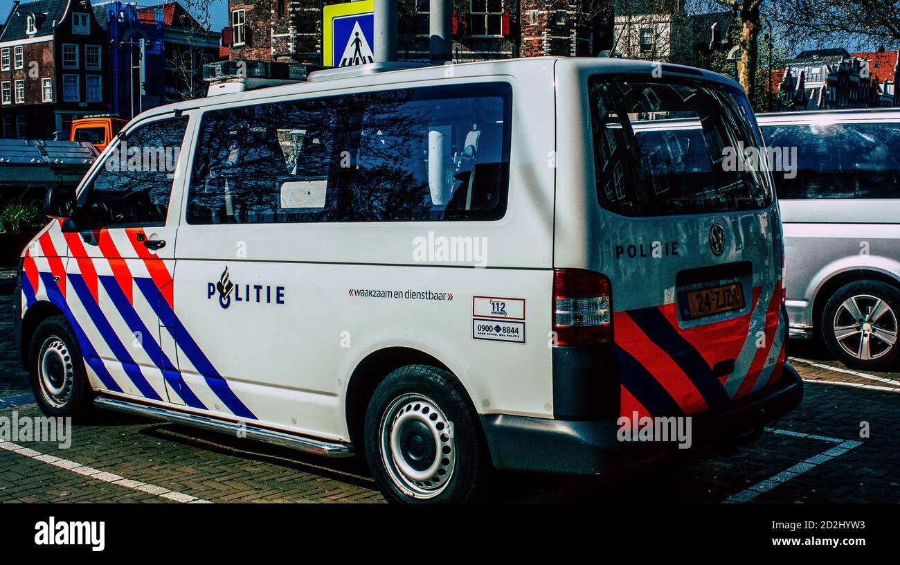 Closeup of an official police car patrolling the streets of the city ...