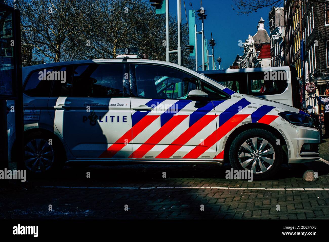 Closeup of an official police car patrolling the streets of the city ...