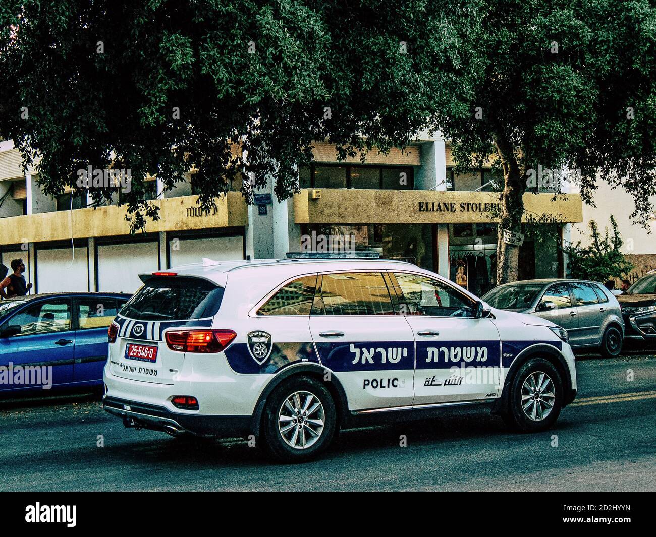 Closeup of an official police car patrolling the streets of the city ...