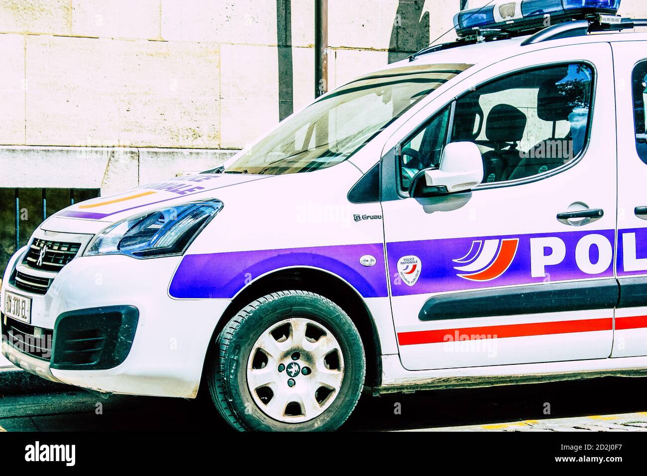 Closeup of an official police car patrolling the streets of the city ...