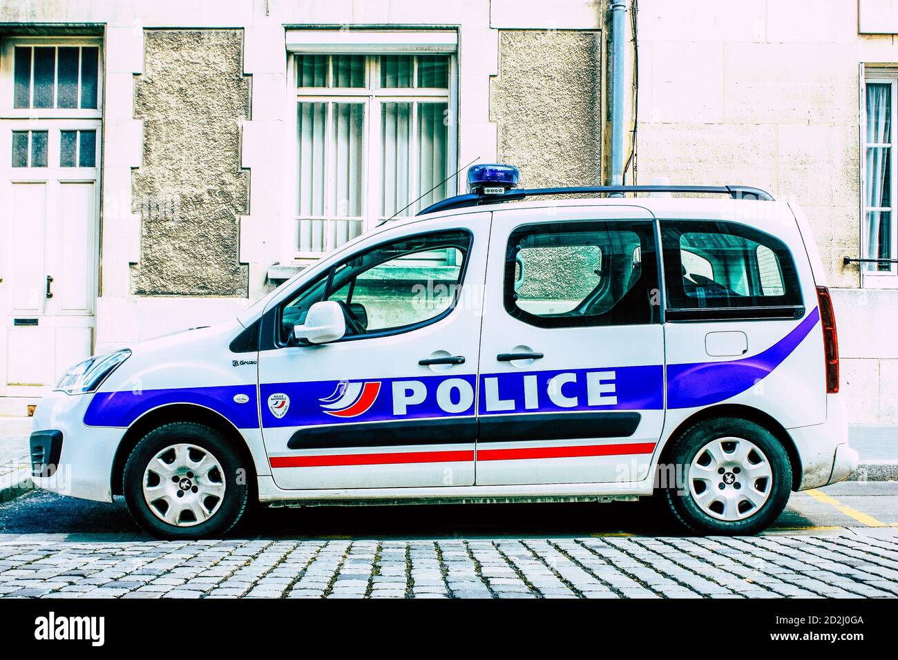 Closeup of an official police car patrolling the streets of the city ...