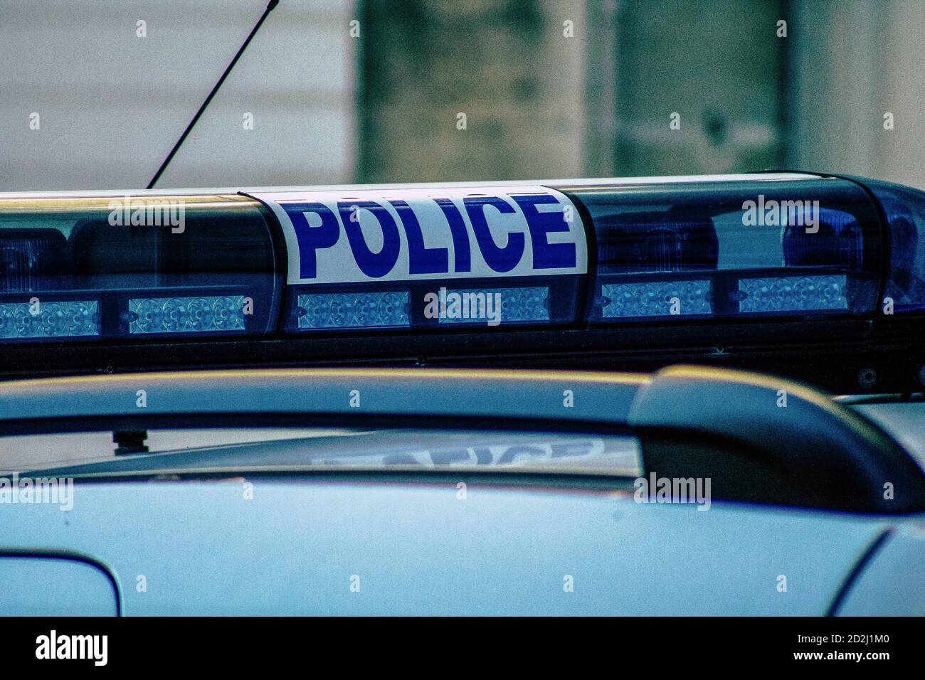 Closeup of an official police car patrolling the streets of the city ...