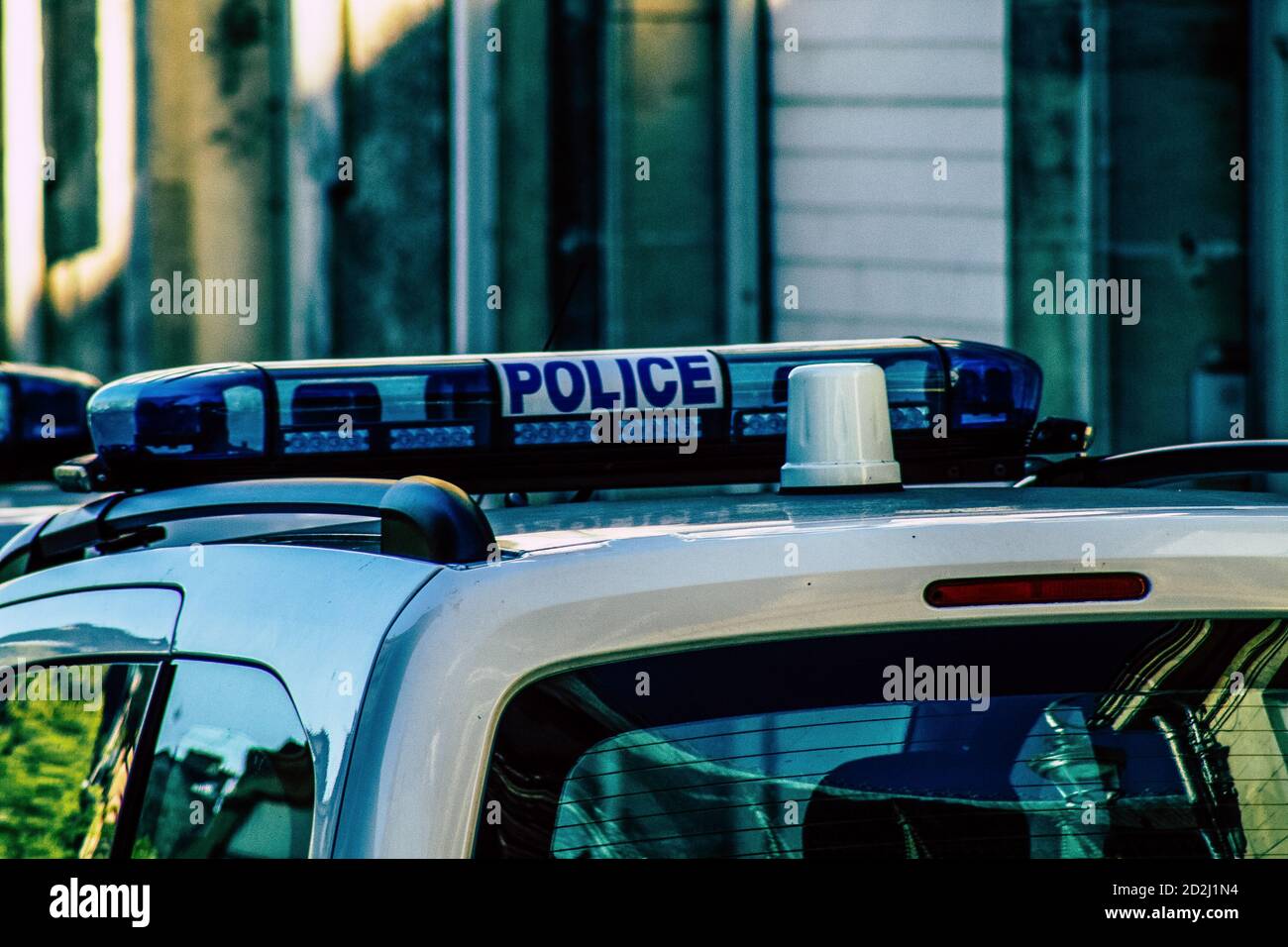 Closeup of an official police car patrolling the streets of the city ...