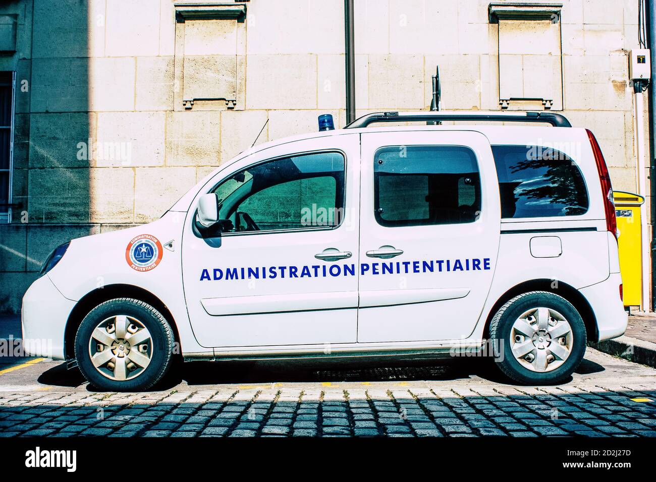 Closeup of an official police car patrolling the streets of the city ...